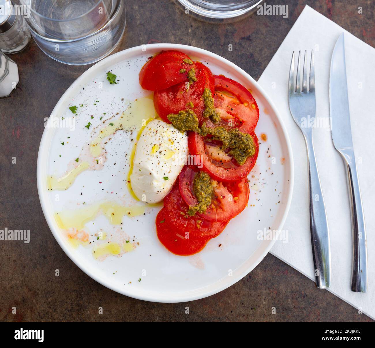 Traditional dish of Italian cuisine caprese salad with fresh tomatoes ...