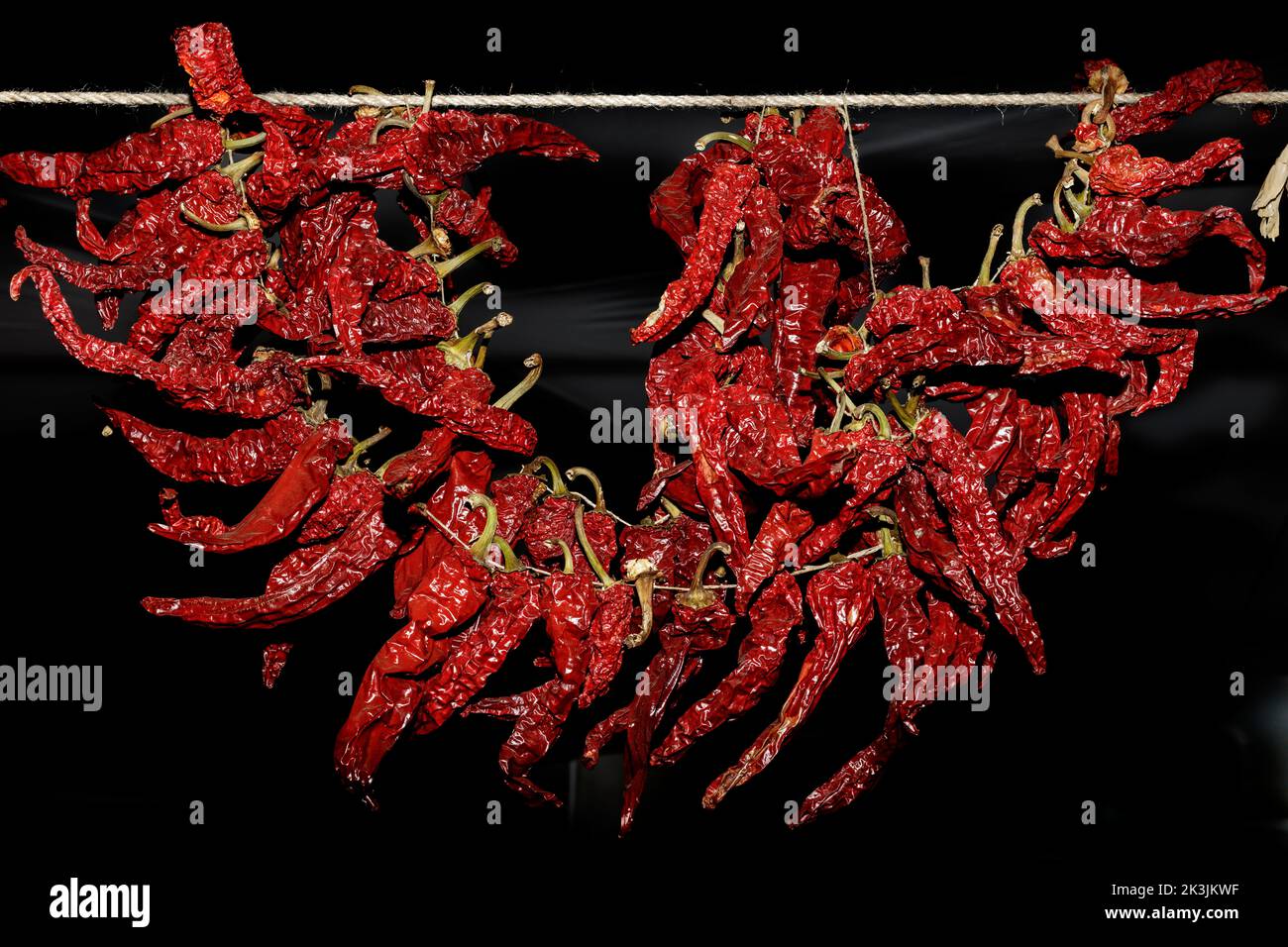 Chillies hanging out to dry Stock Photo - Alamy