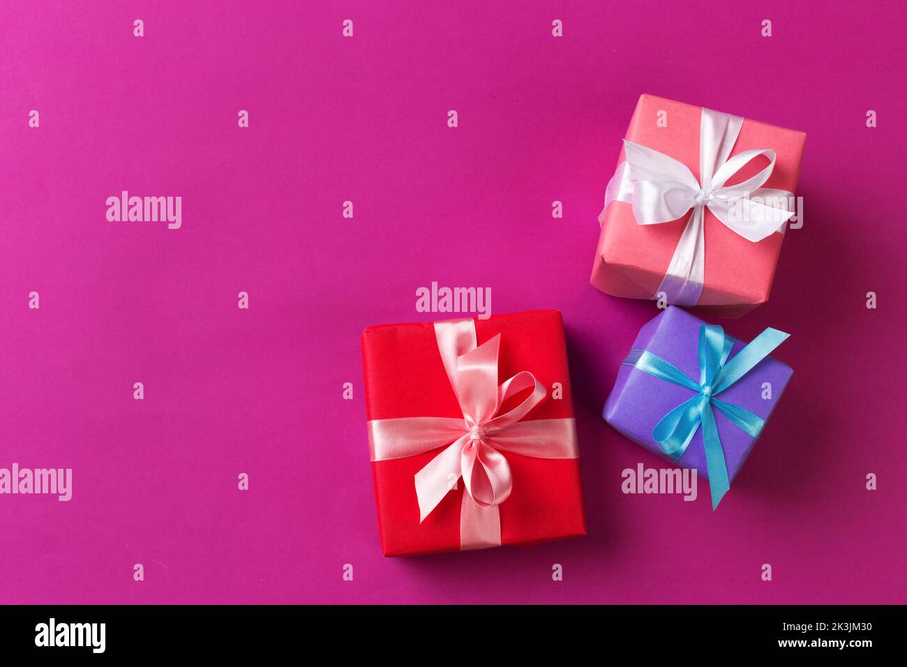 gift box on color background Stock Photo - Alamy