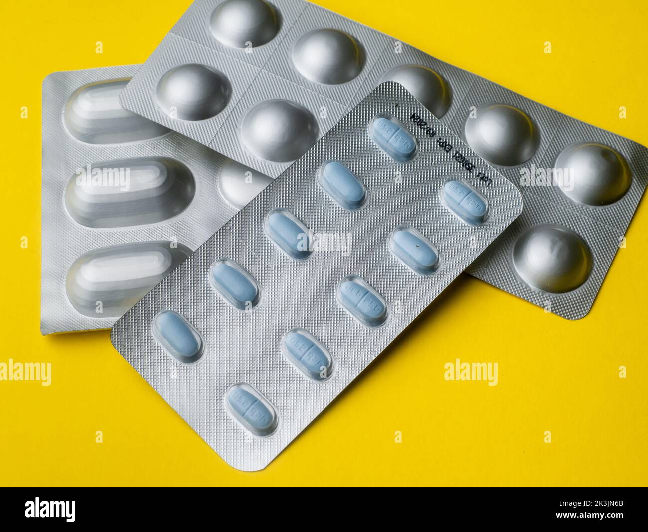 Close Up Of Different Tablet Blisters On Yellow Background Stock Photo ...