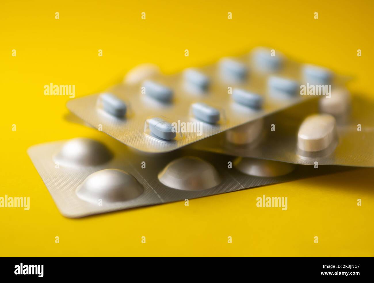 Photo Of Full Tablet Blisters On Yellow Background Stock Photo - Alamy
