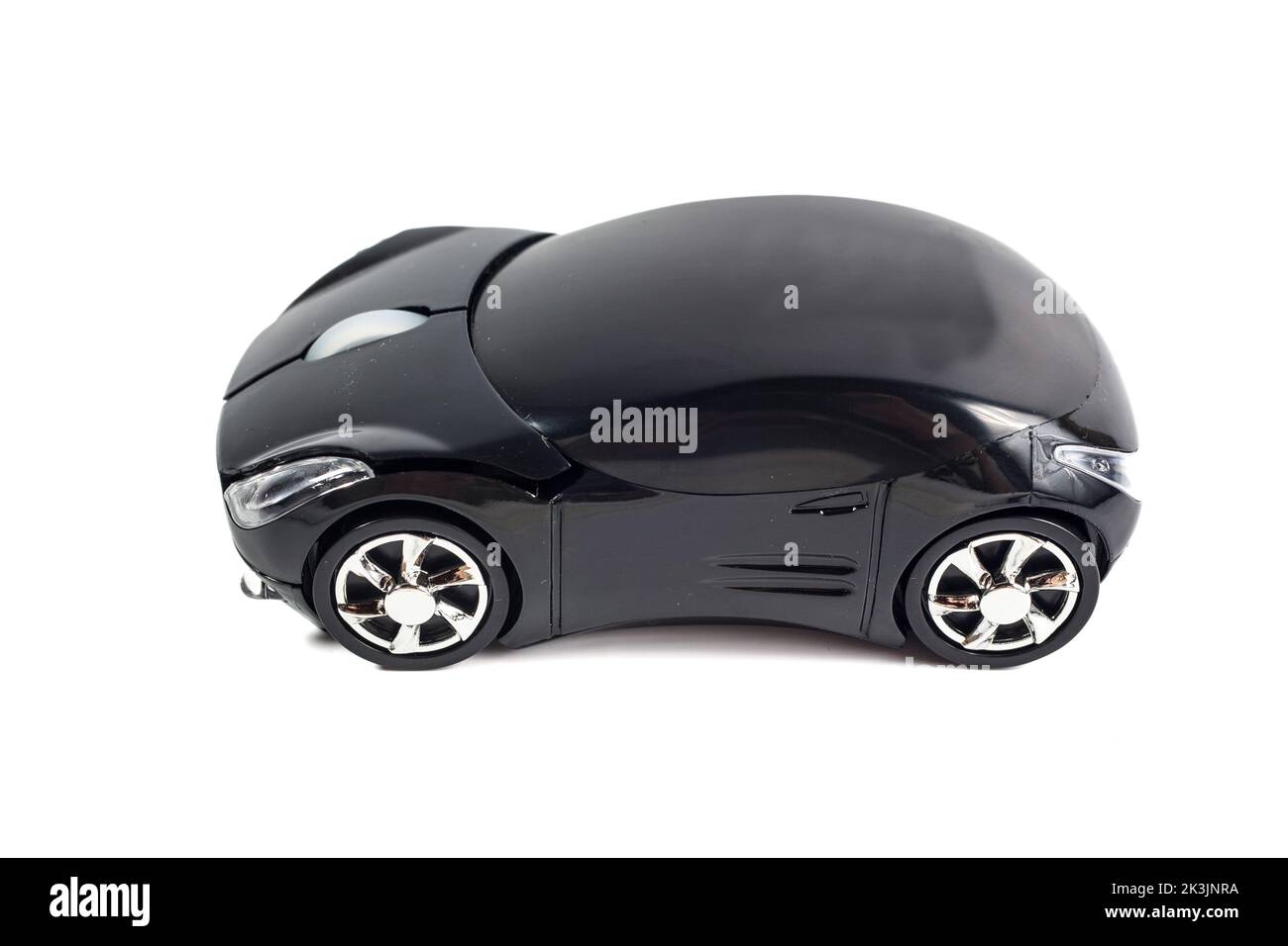 A black car toy isolated on a white background Stock Photo - Alamy