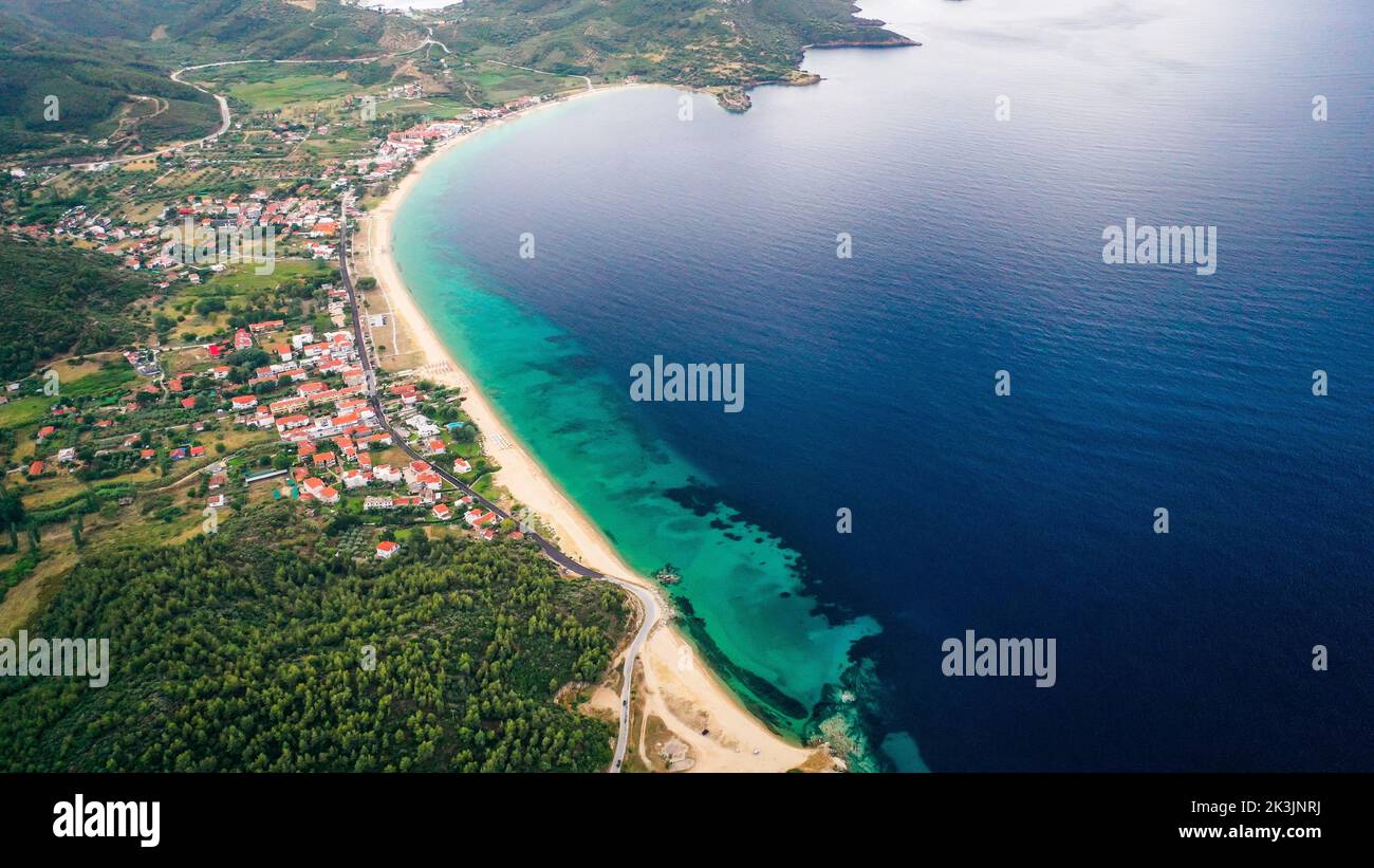 An aerial view of the coastal village and Toroni beach in Sithonia ...