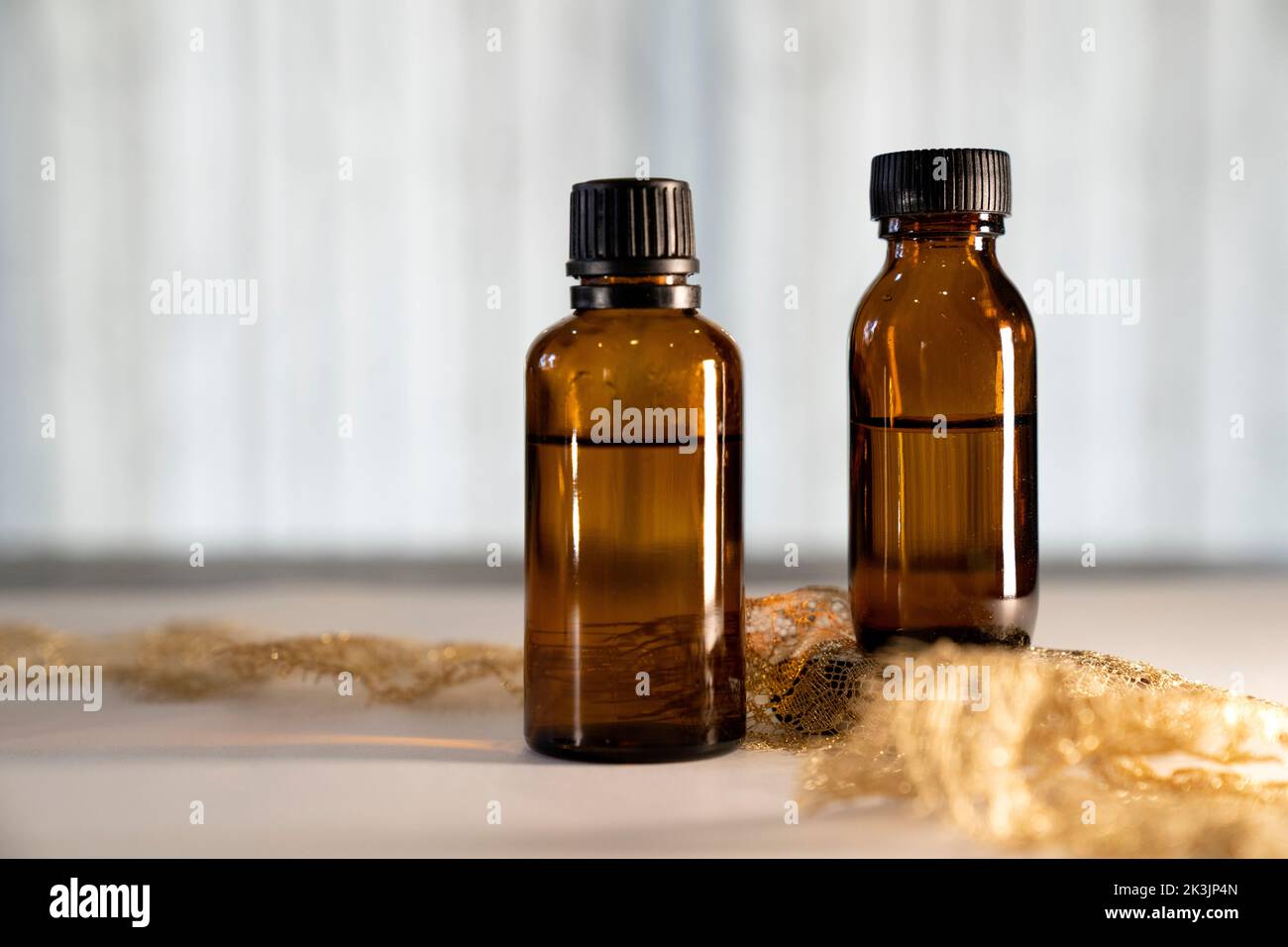 Various sizes of amber glass bottles Stock Photo - Alamy