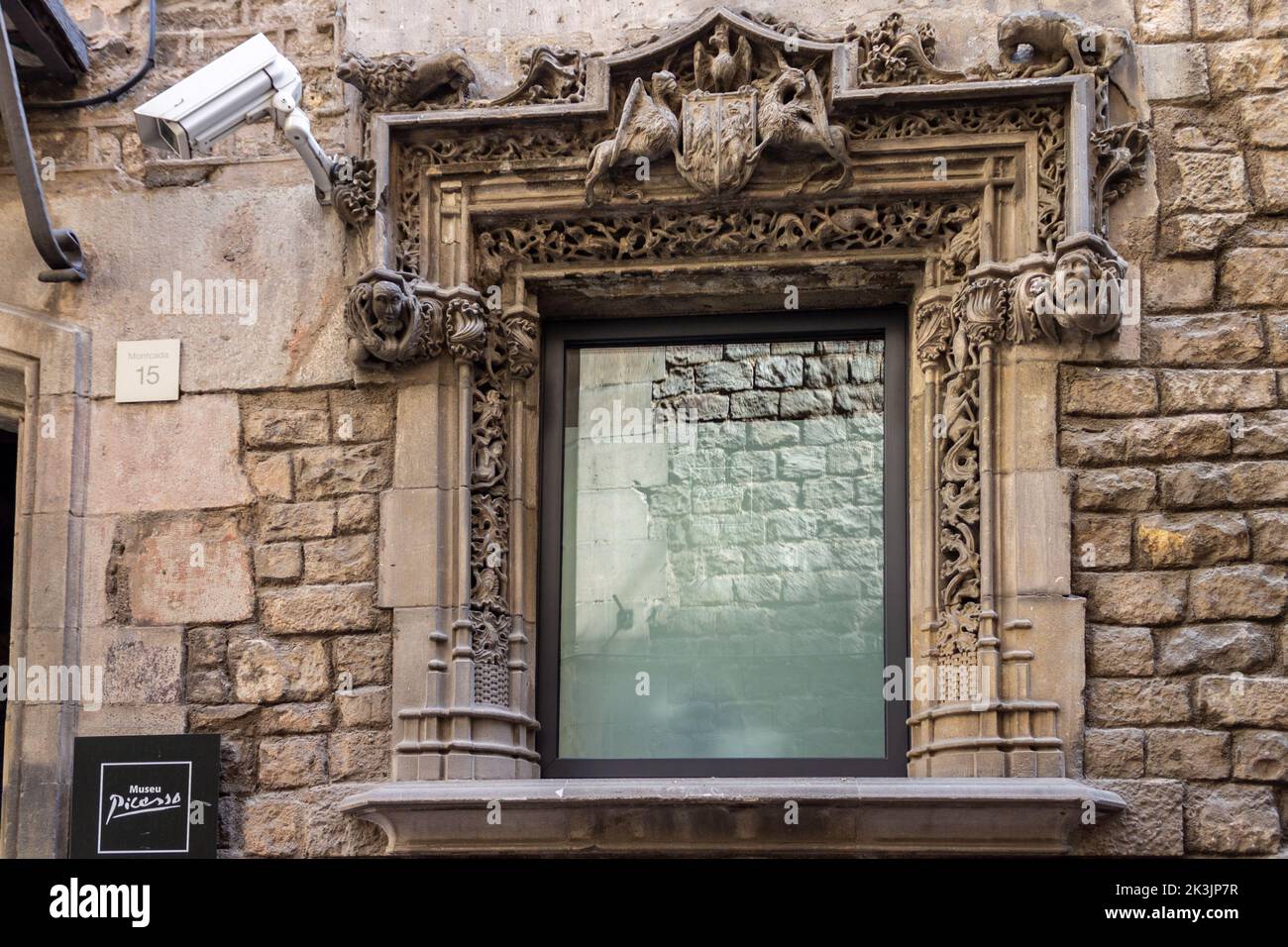 The detail over a window on the stone wall of Picasso Museum in ...