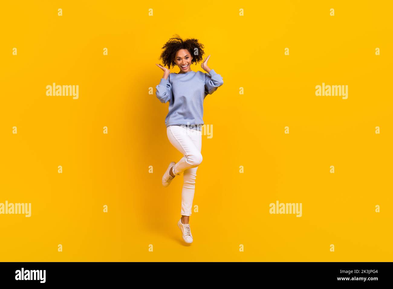 Full size portrait of overjoyed pretty lady jumping hands touch wavy ...