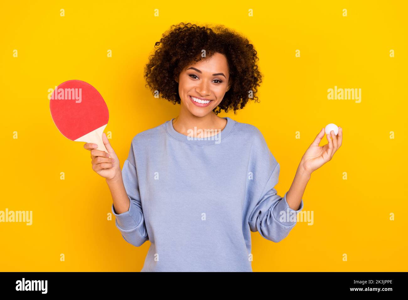 Portrait of positive pretty person hold ping pong racket ball toothy ...