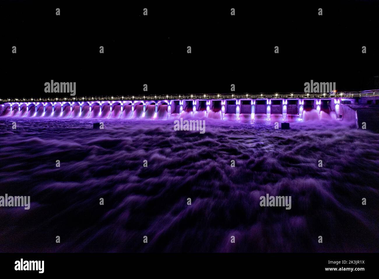 A scenic shot of a waterscape with decorative purple lights in Ontario ...