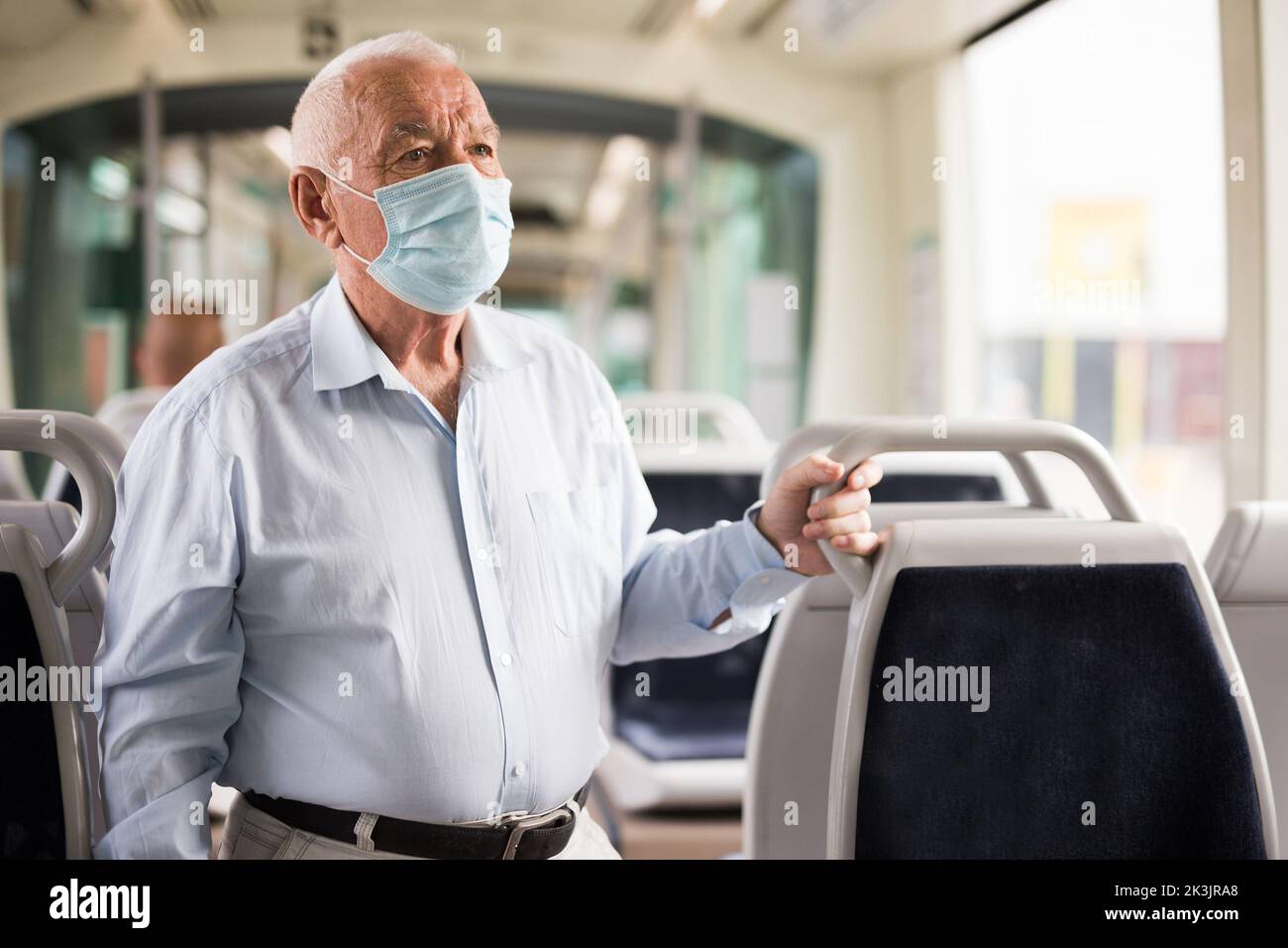 Senior European man in tram Stock Photo - Alamy