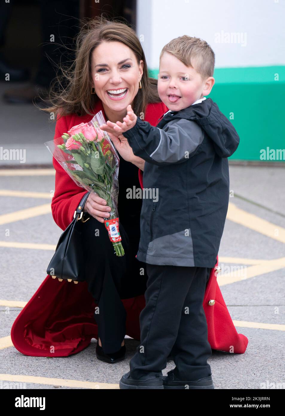 The Princess of Wales receives a posy of flowers from four-year-old ...