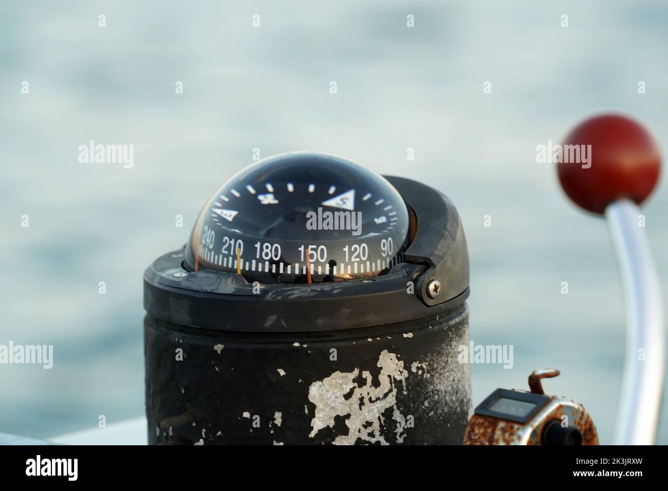 boat control engine speed knob and compass Stock Photo - Alamy