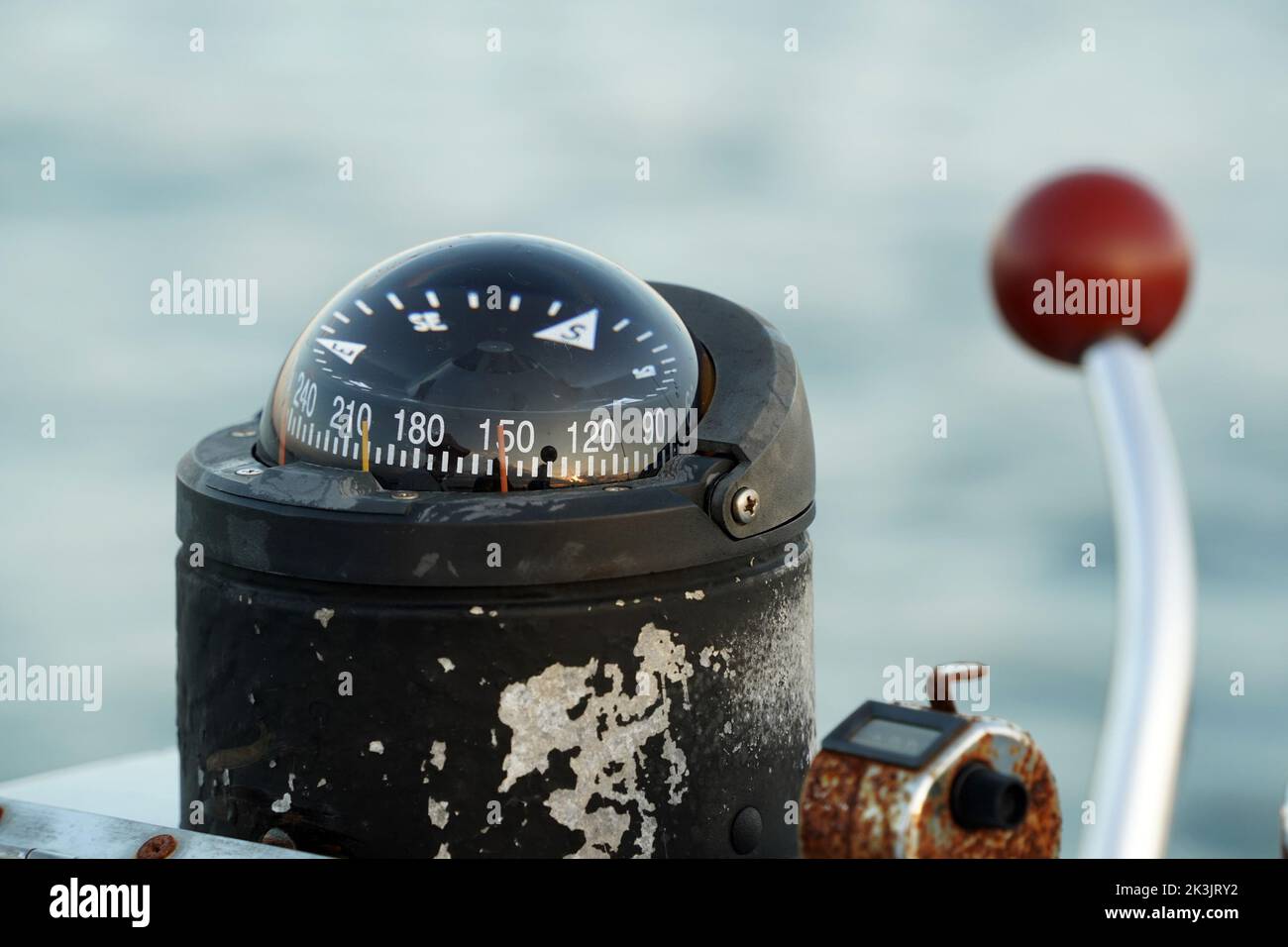 boat control engine speed knob and compass Stock Photo - Alamy