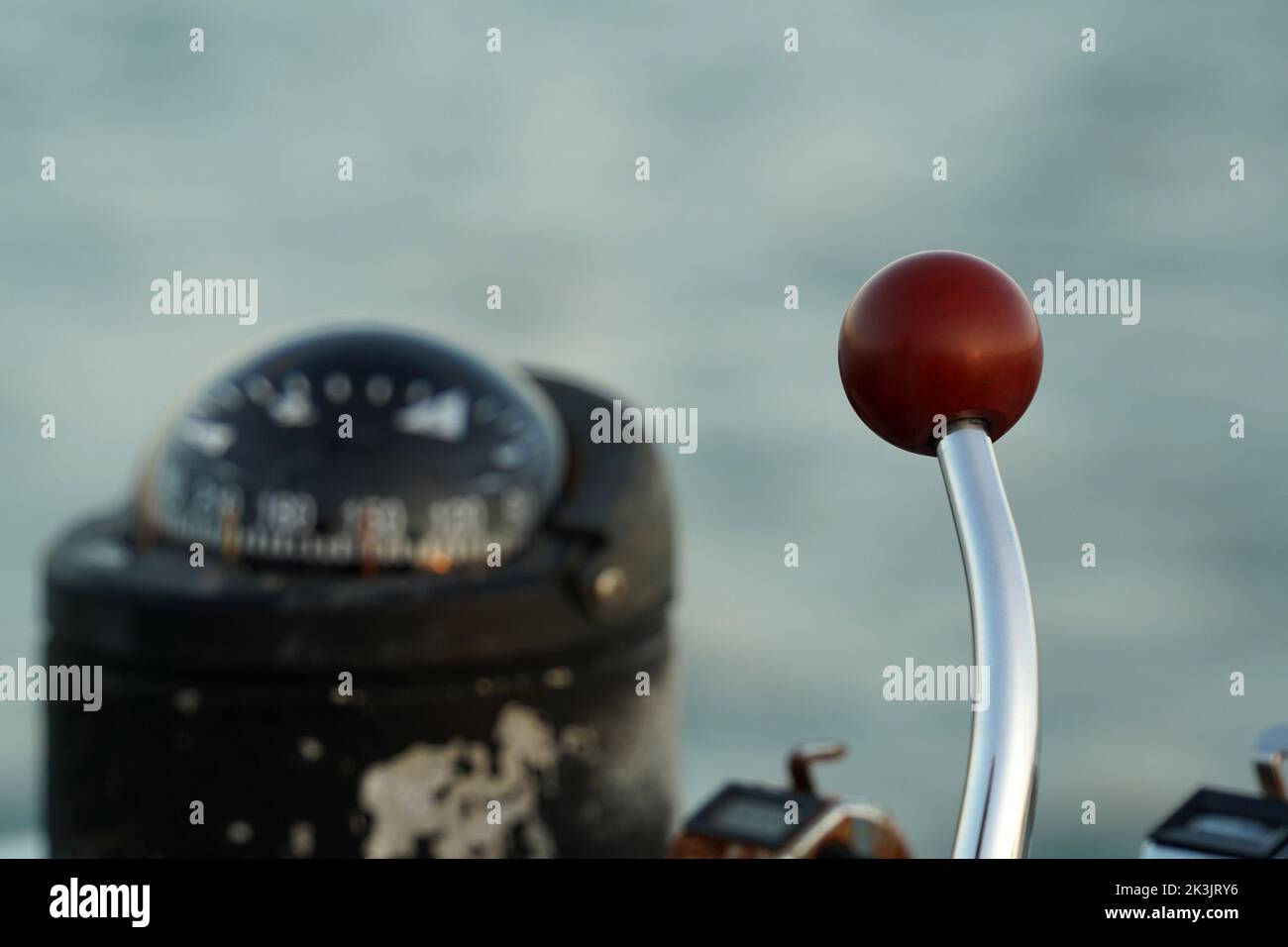 boat control engine speed knob and compass Stock Photo - Alamy