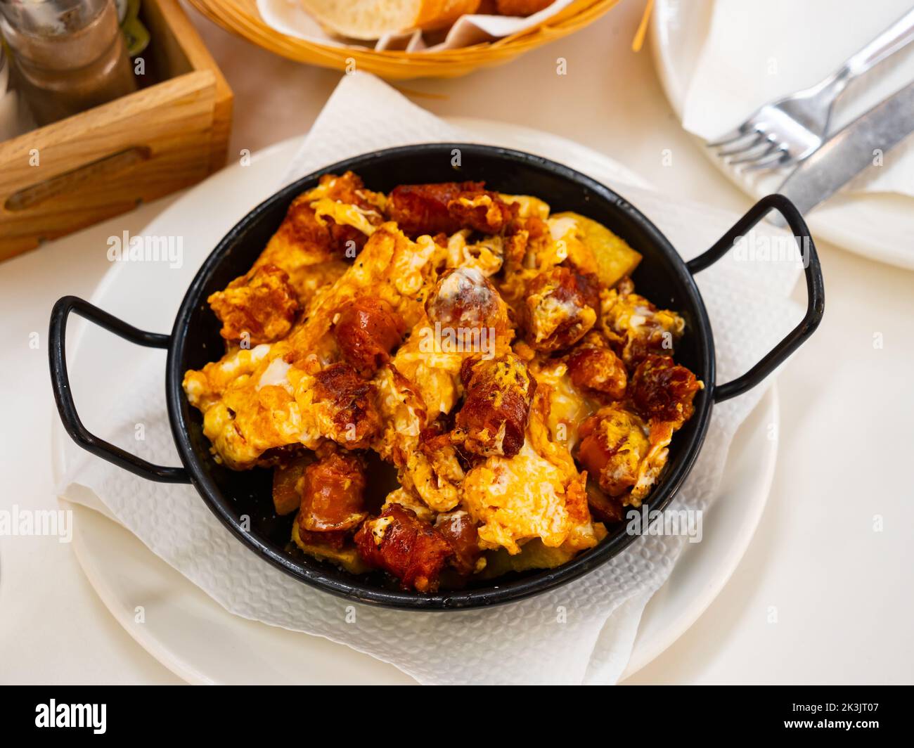 Portion of scrambled eggs with sausages Stock Photo - Alamy