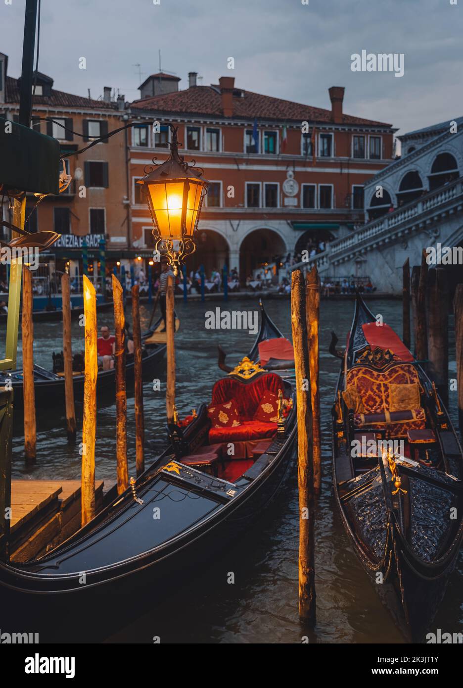A vertical shot of gondolas in the canal in Venice, Italy Stock Photo ...