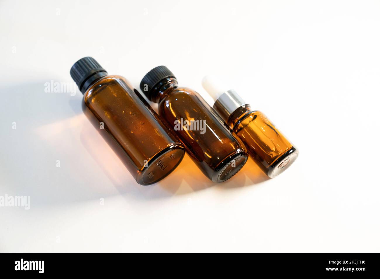 Various sizes of amber glass bottles Stock Photo - Alamy