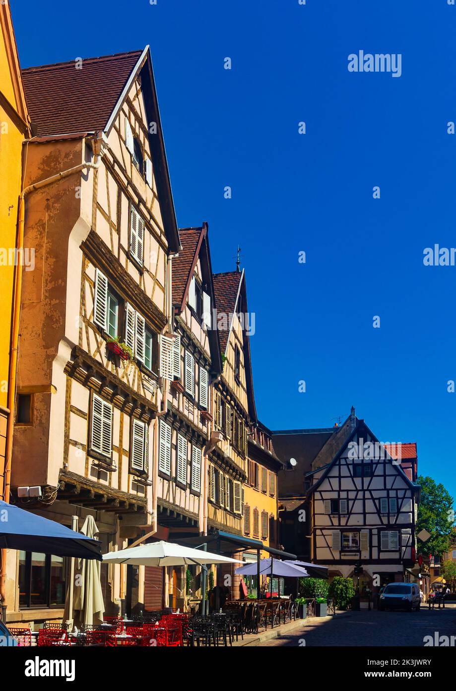 Historic center of Colmar with paved streets and half-timbered houses ...