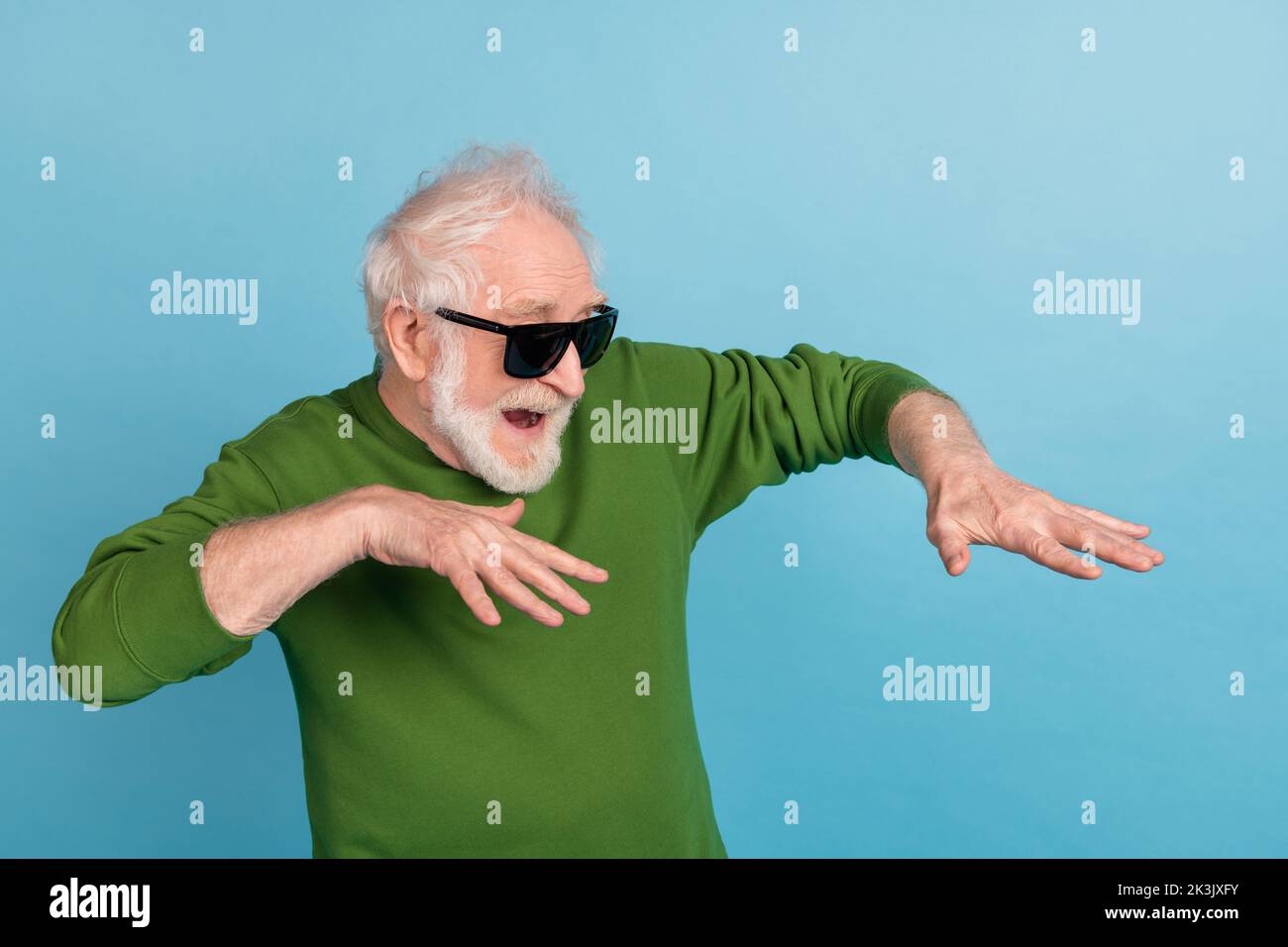 Photo of satisfied overjoyed funny granddad arms make moves dancing ...