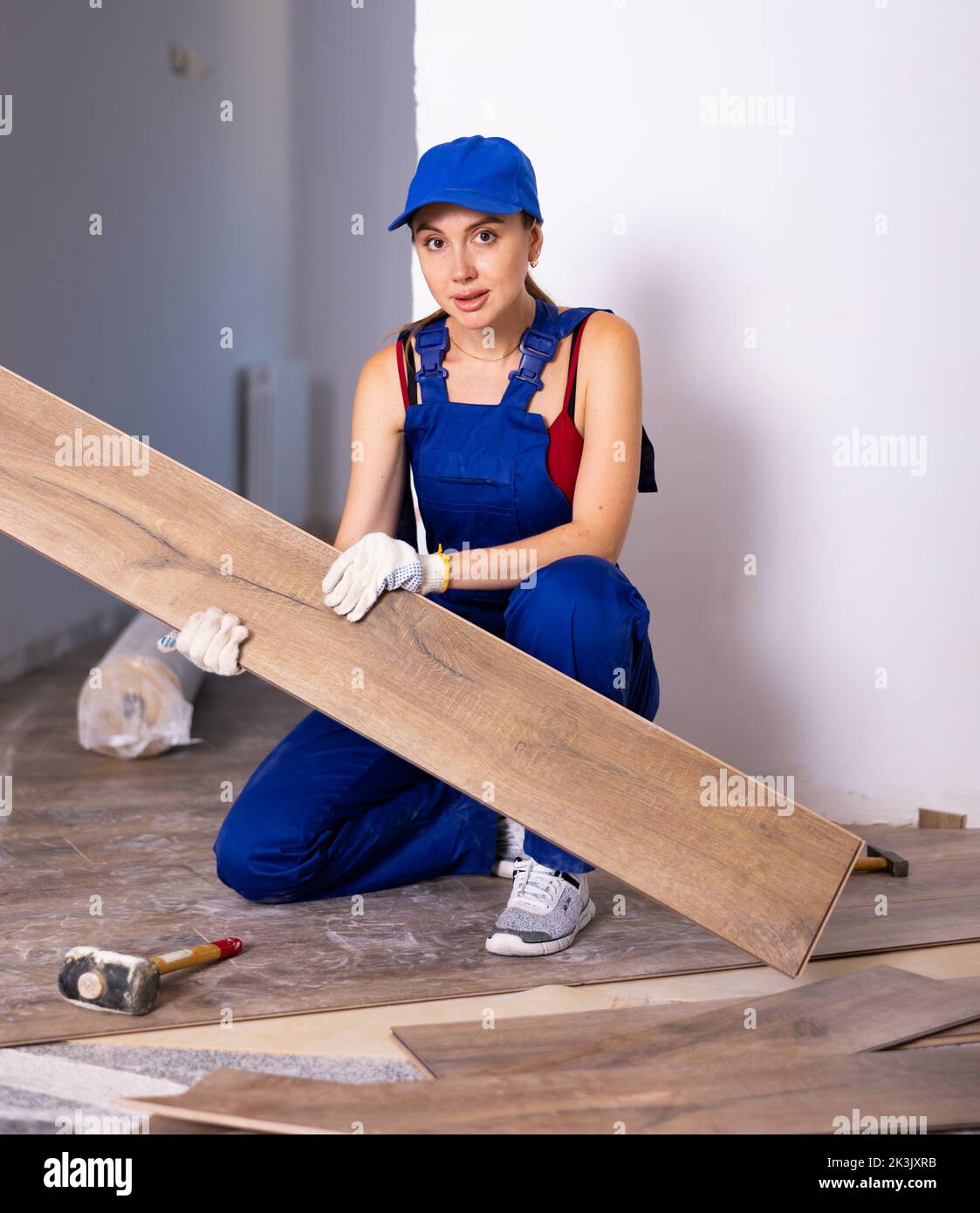 Woman laying laminate hi-res stock photography and images - Alamy