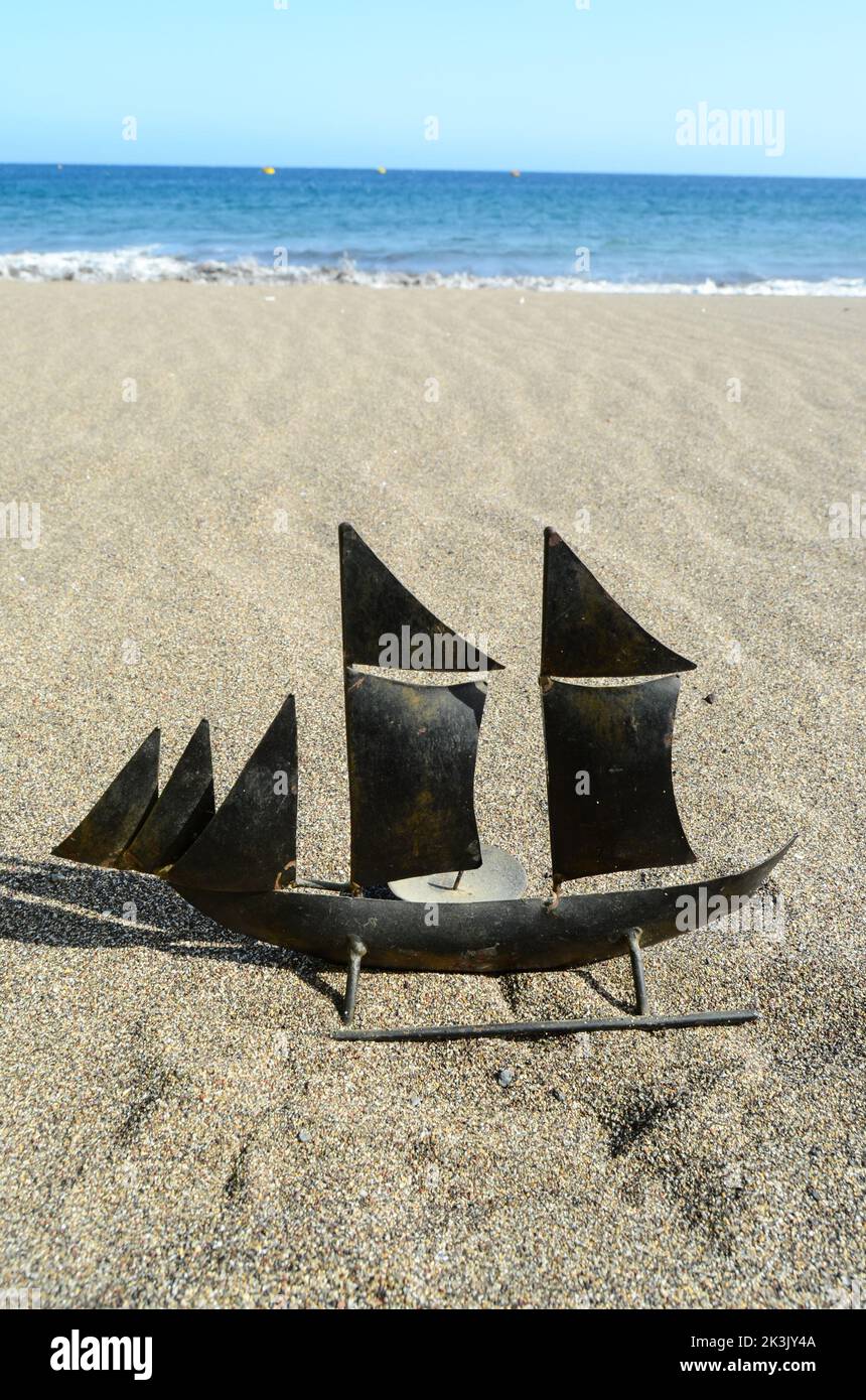 Sail Ship Toy Model in the Beach Sand Close-up Stock Photo - Alamy