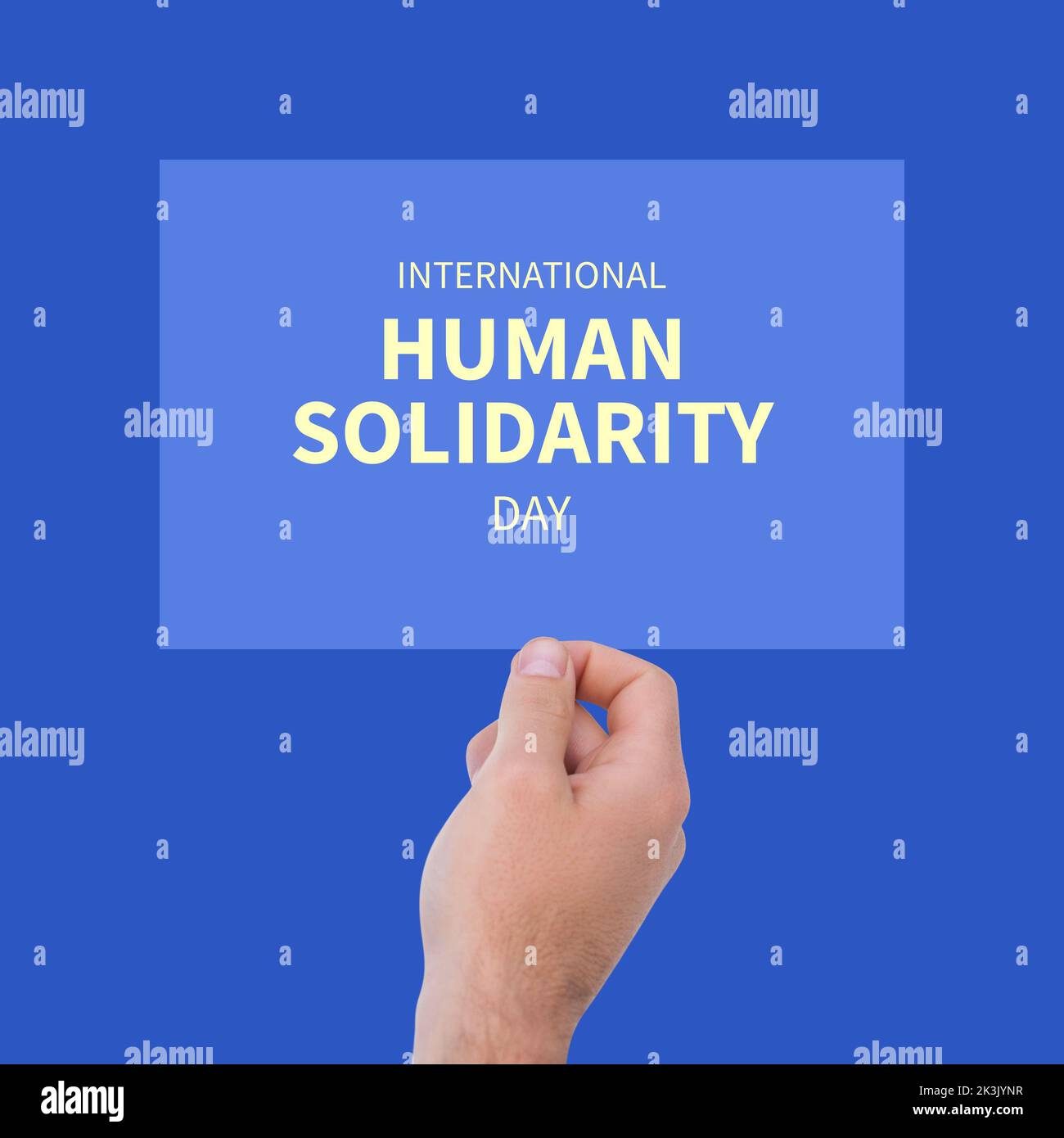 Composition of hand holding blue board with international human ...