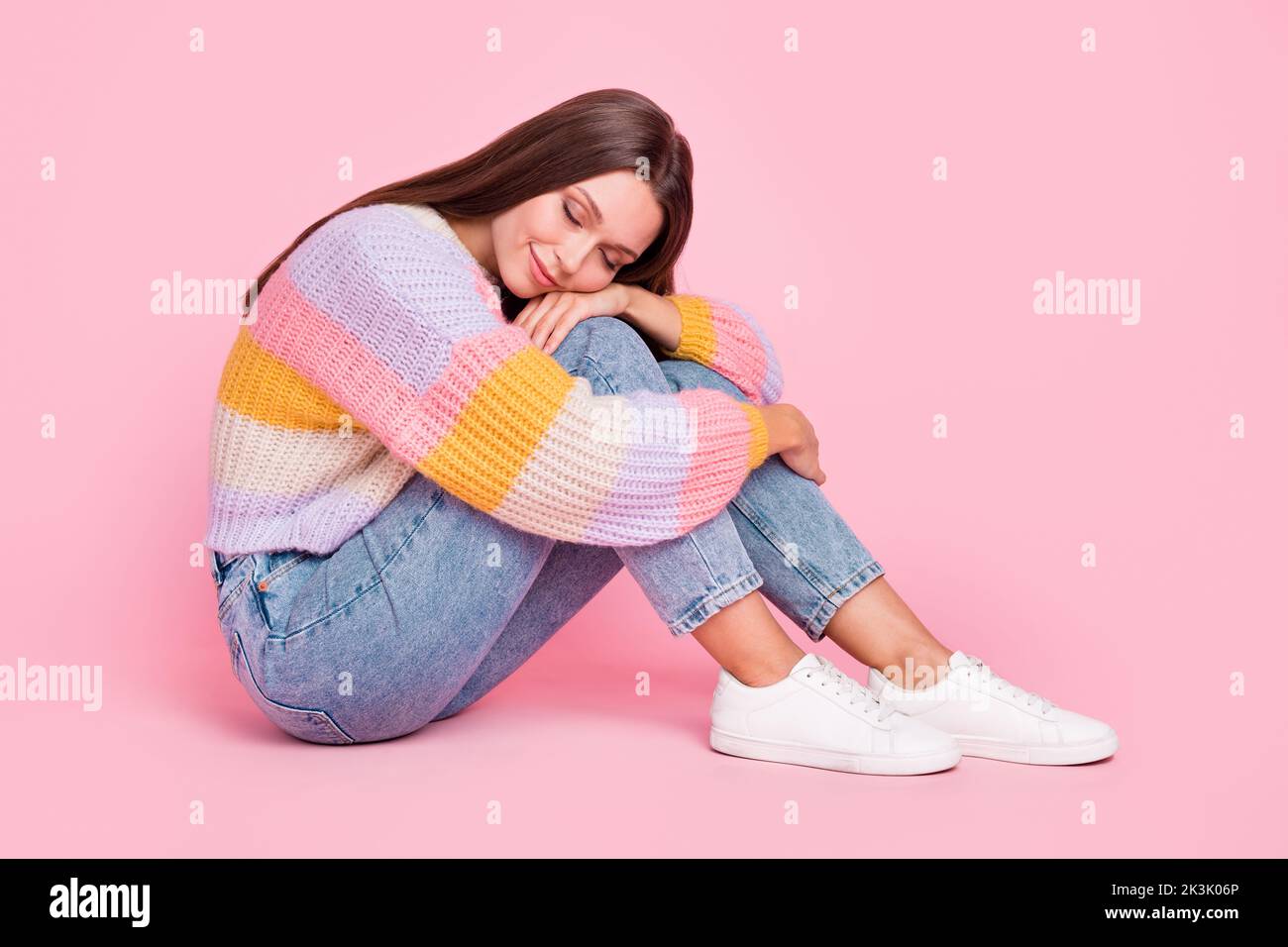 Full length profile photo of satisfied carefree person closed eyes sit floor isolated on pink ...