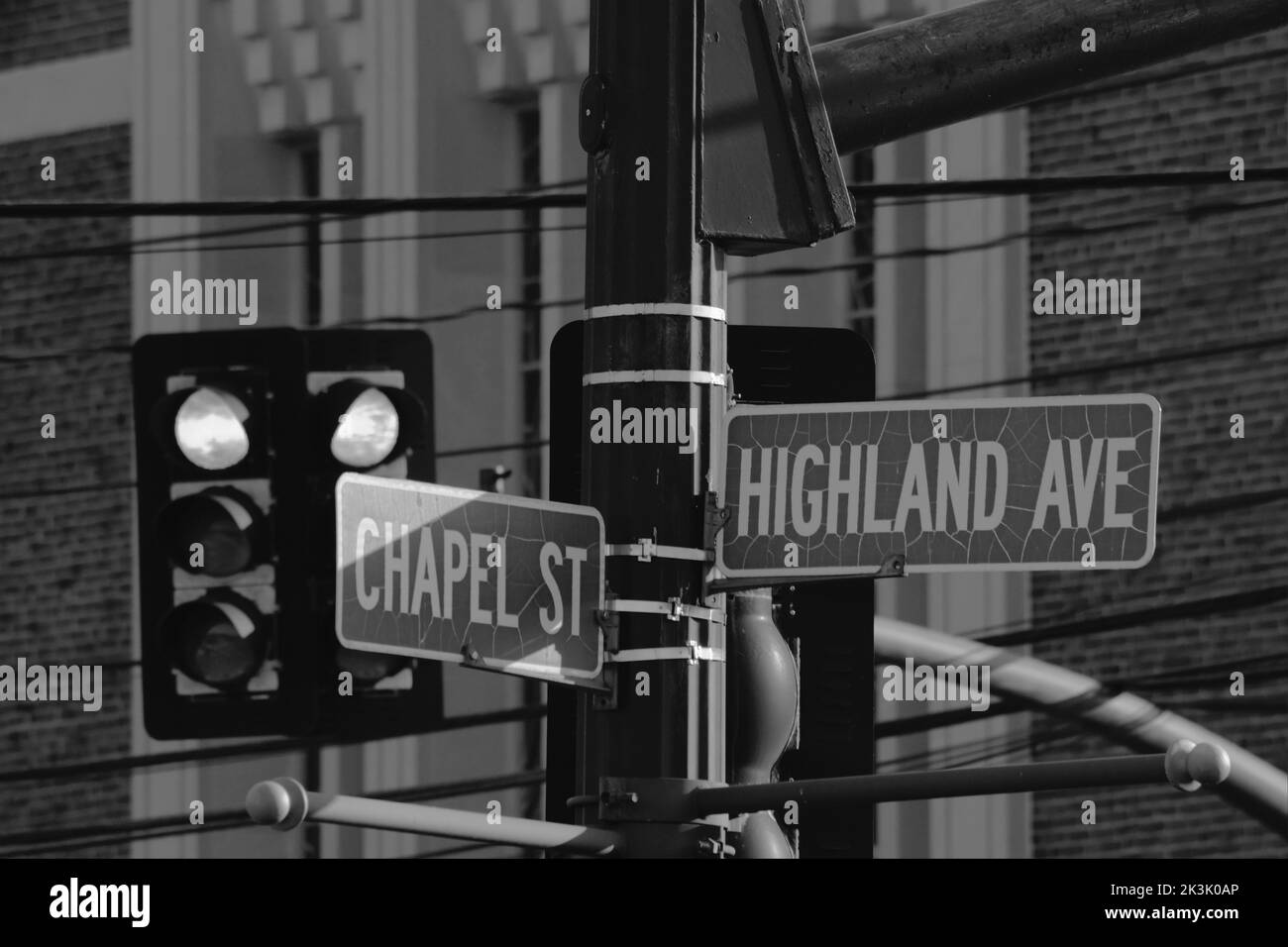 A grayscale of street signs with a building in the background Stock ...
