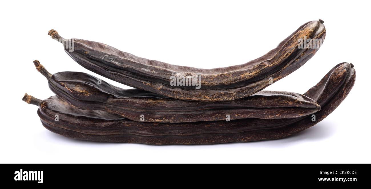 Ripe Carobs fruits pods isolated on white background Stock Photo - Alamy