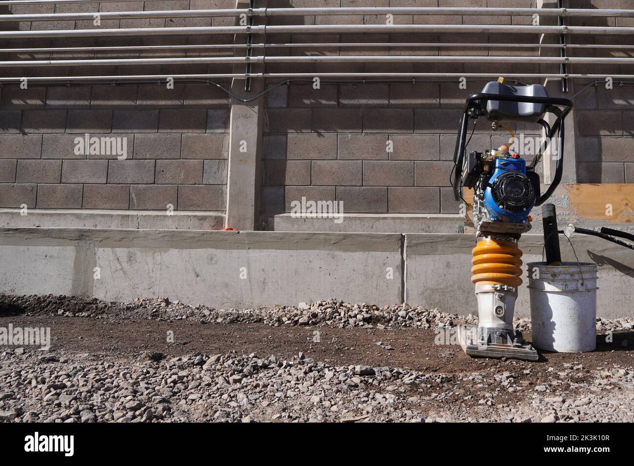 A ground compactor on a construction site Stock Photo - Alamy