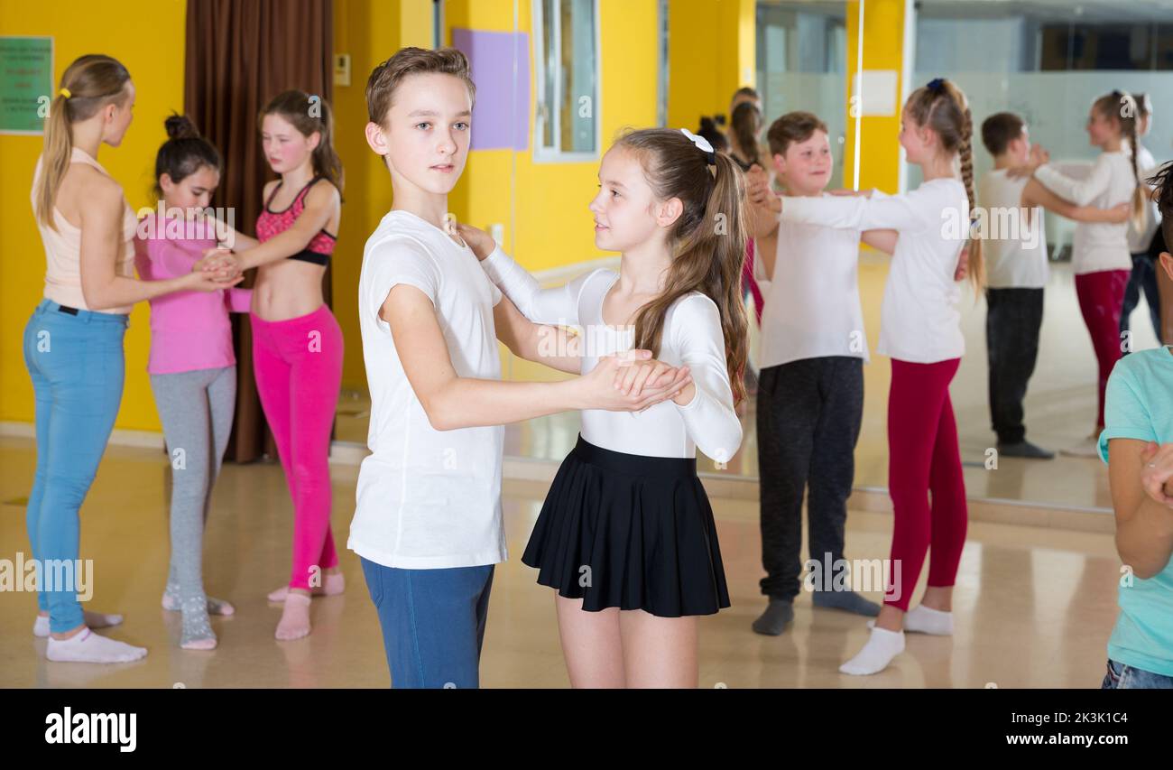 Tweens training slow foxtrot in dance studio Stock Photo - Alamy
