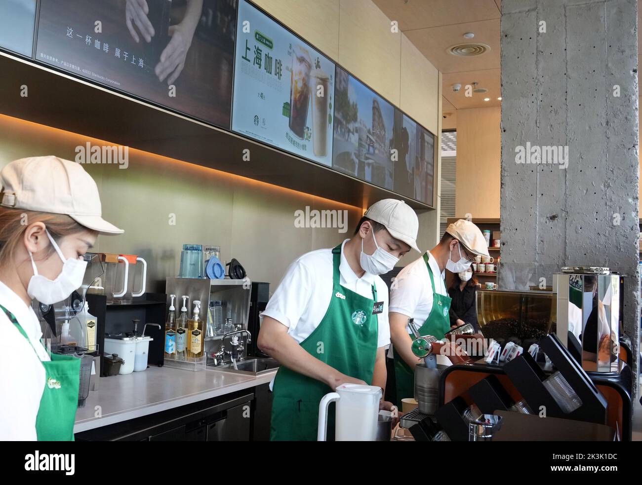 Shanghai, China. 27th Sep, 2022. Staff members work at a Starbucks ...