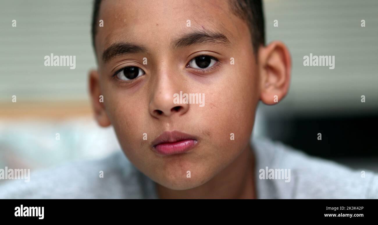 Hispanic little boy child portrait, no expression serious emotion Stock ...