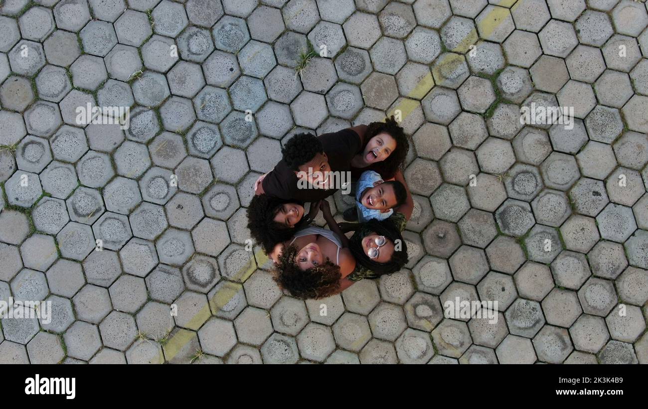 Family holding hands together from above, community support concept and ...