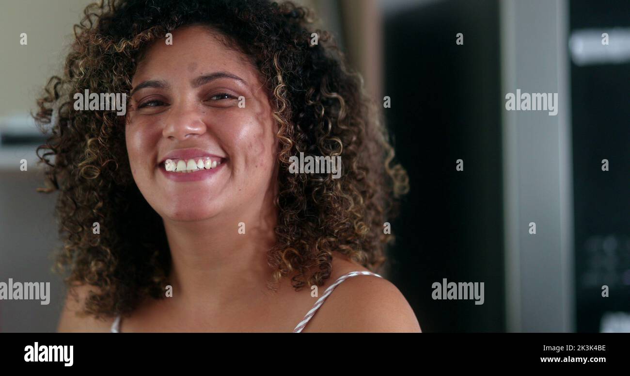Latina black woman speaking laughing in conversation Stock Photo - Alamy