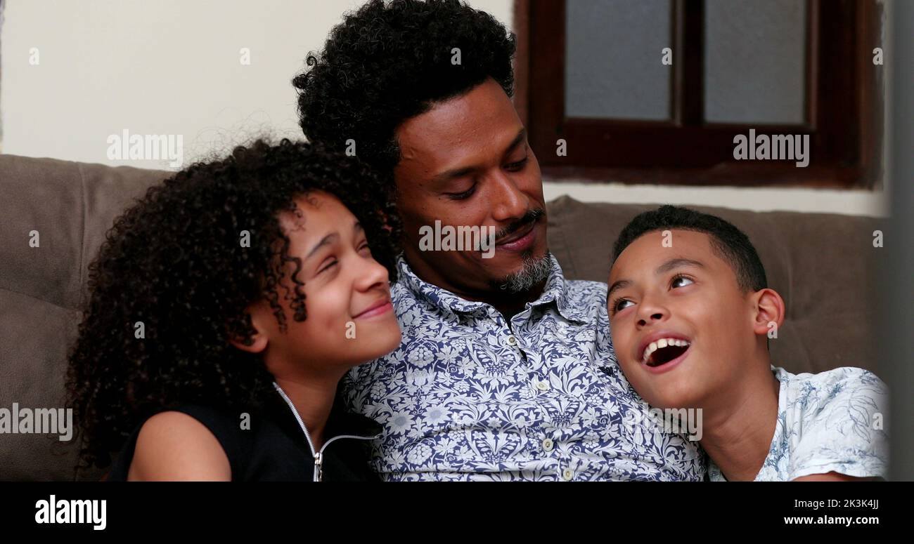 Happy African father and children relationship. Dad talking to daughter ...