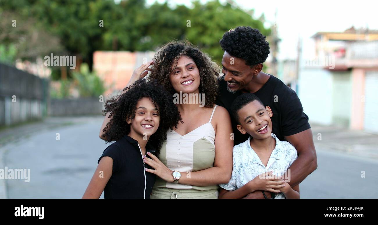 Happy African family portrait standing for photo outside. Cheerful ...