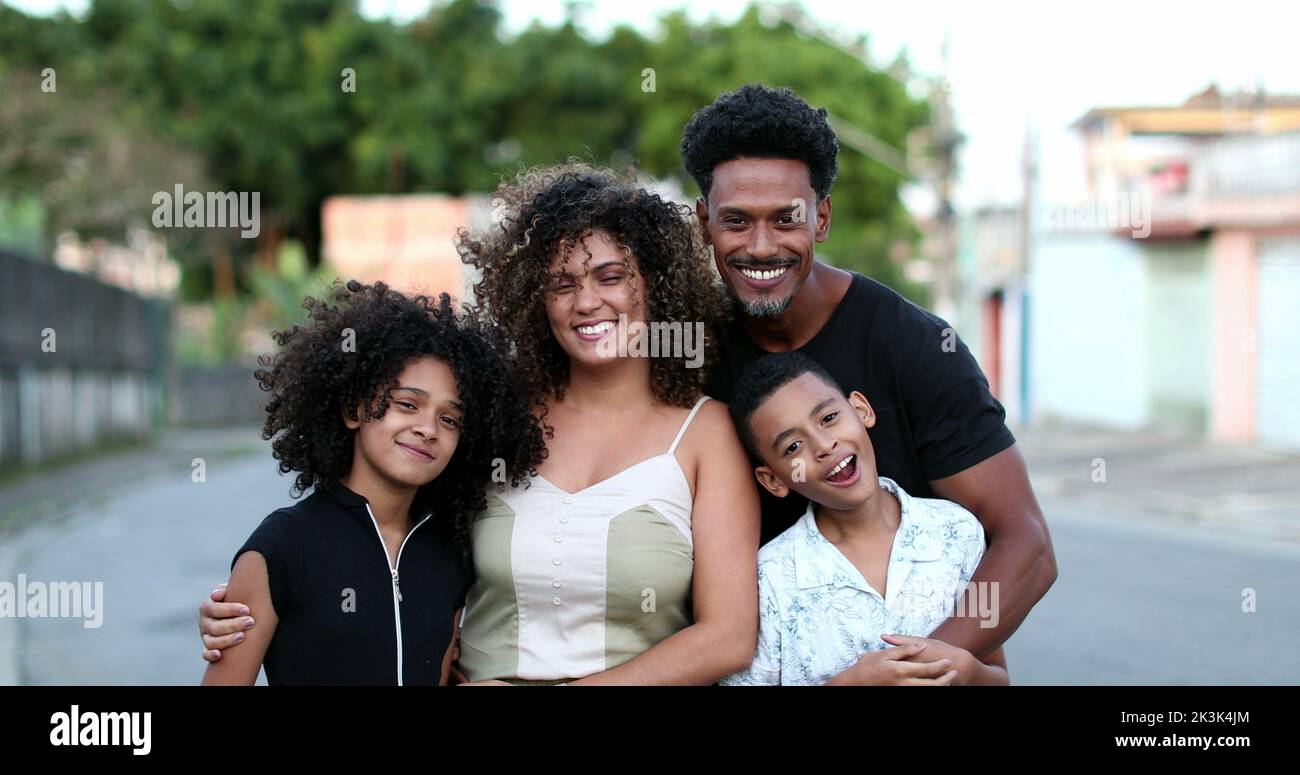 Happy African family hugging and embracing. Affectionate black family ...