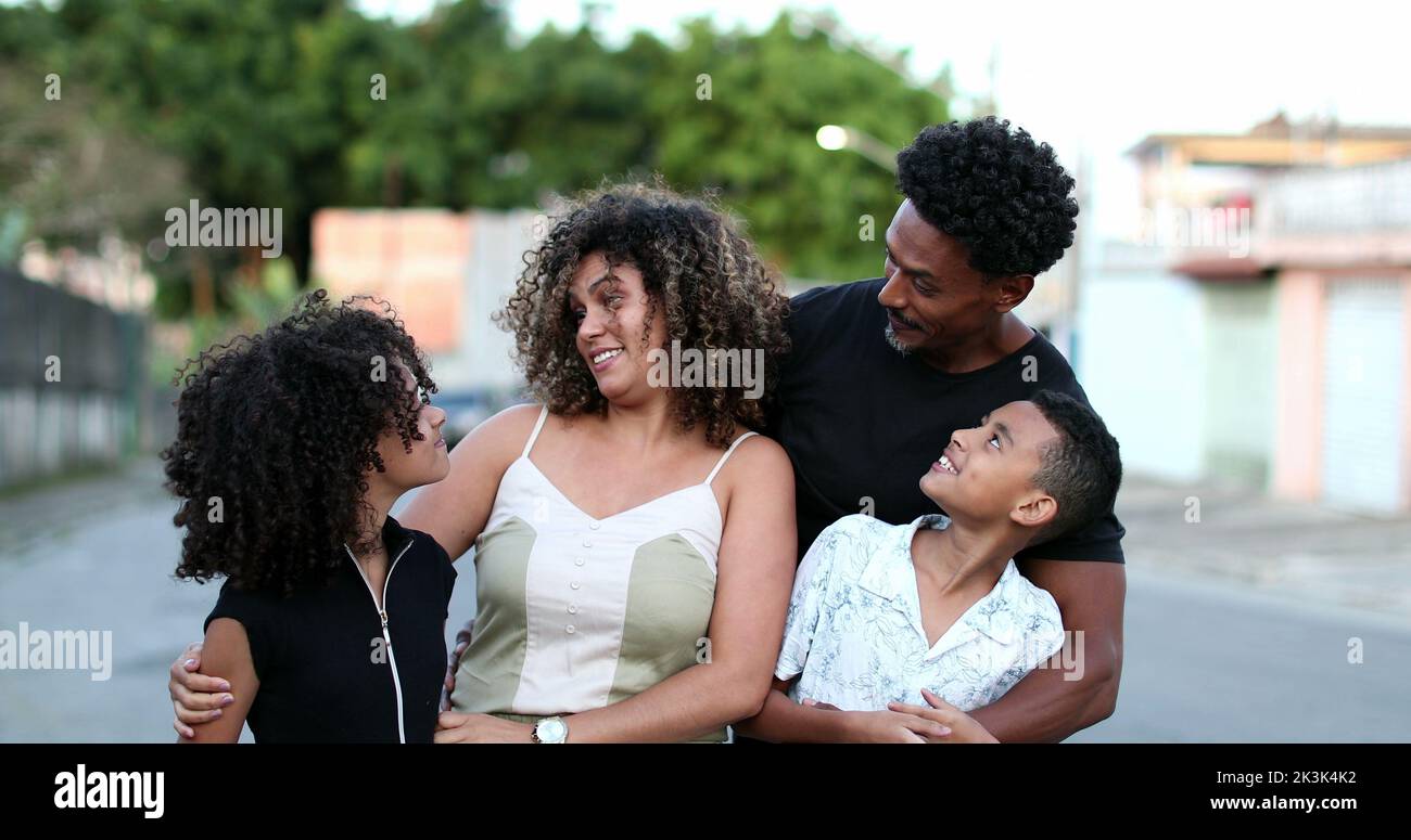 Happy African family hugging and embracing. Affectionate black family ...