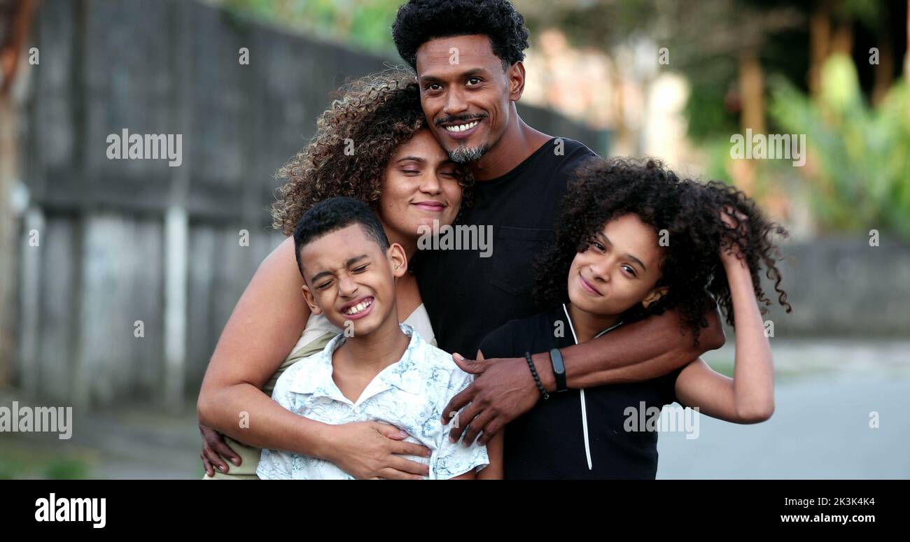 Funny African family portrait standing for photo outside. Cheerful ...