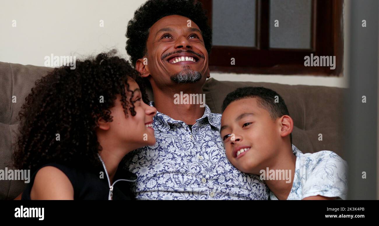 Happy African father and children relationship. Dad talking to daughter ...