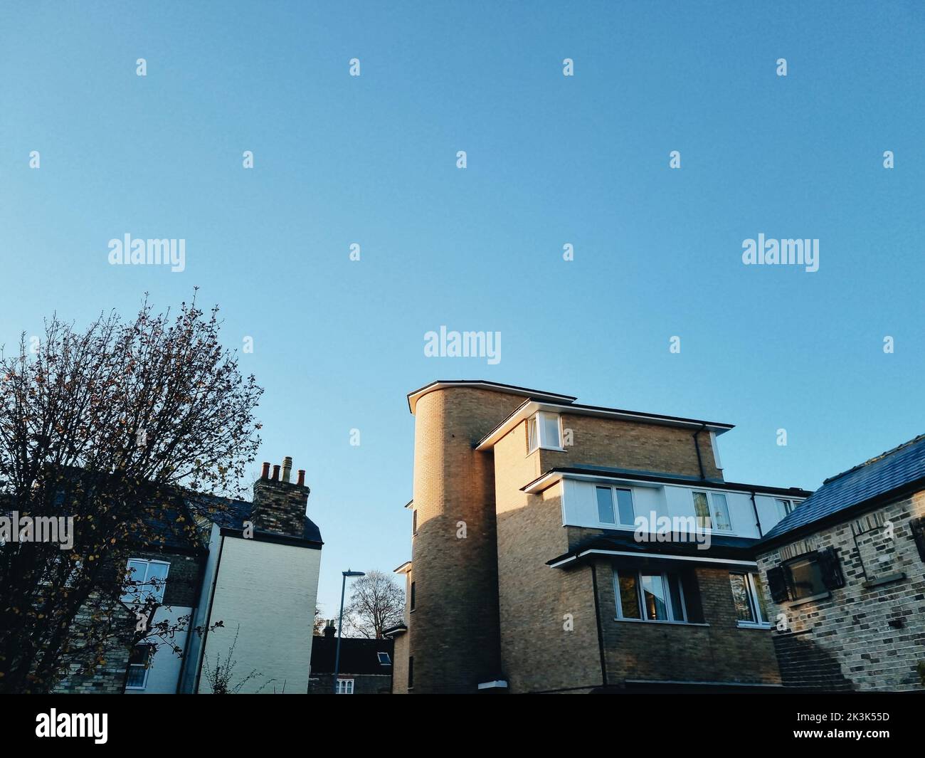 A morning cloudless sky sunlight shining on residential buildings Stock ...