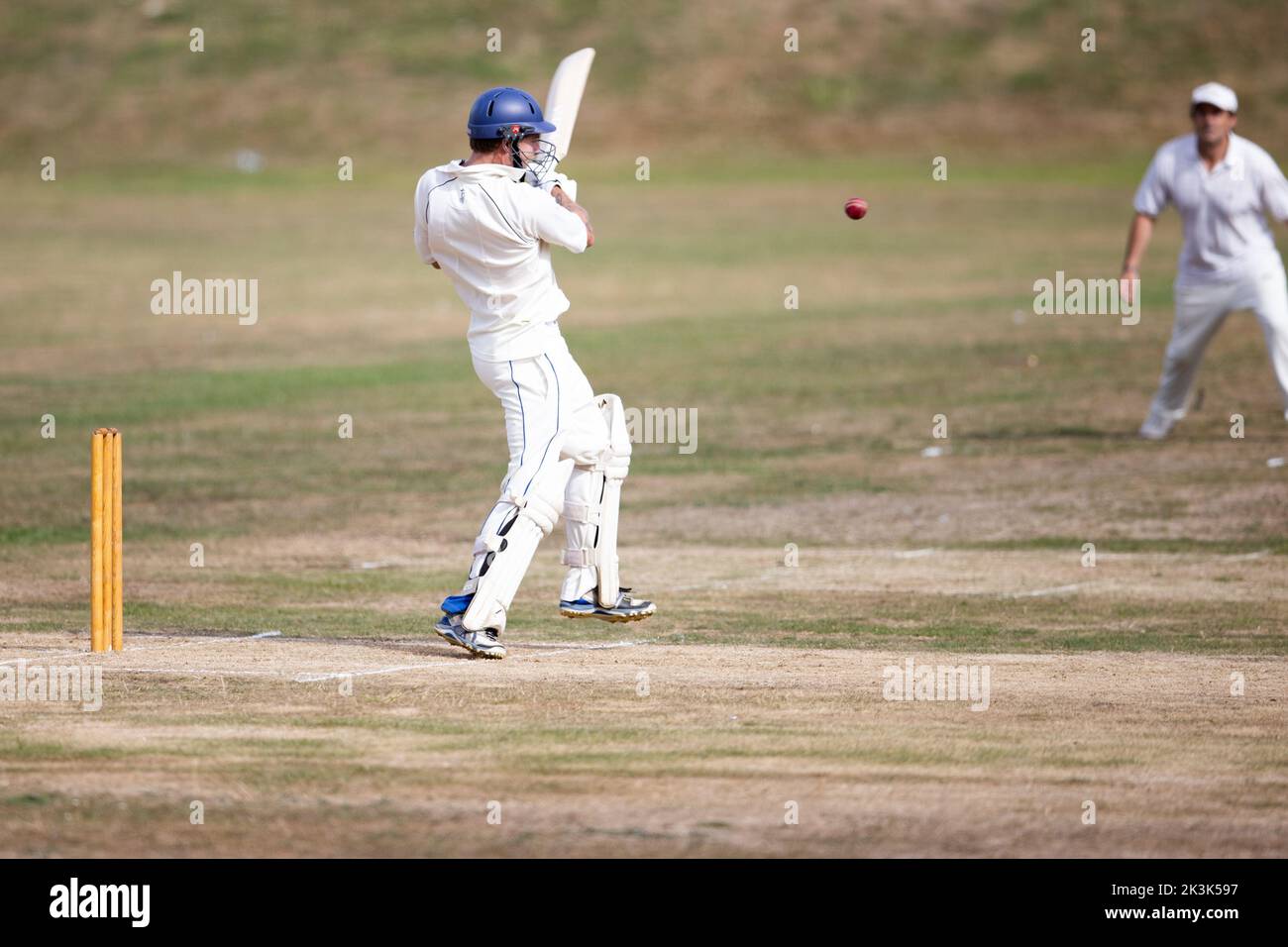 Cricket bowling & batting mens game Stock Photo - Alamy