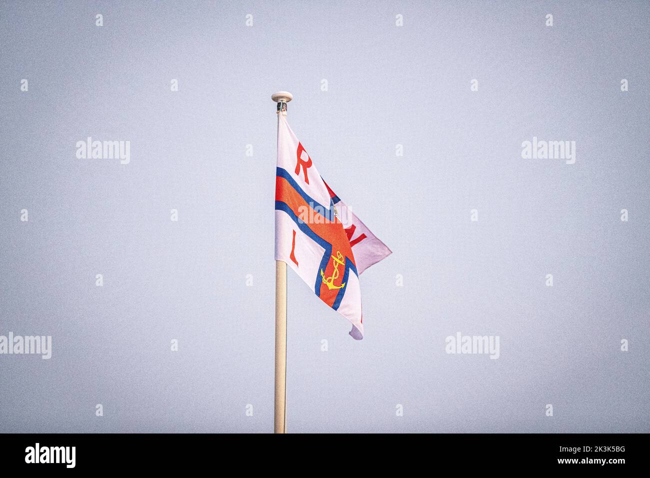 RNLI flag Royal National LIfeboat flag outside LIfeboat House Stock ...