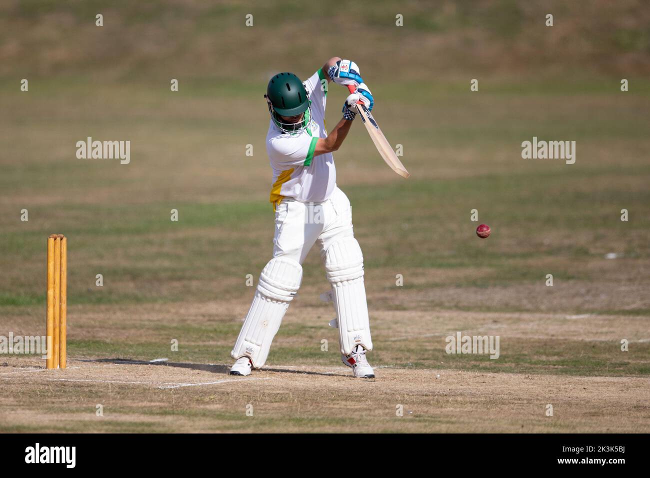 Cricket bowling & batting mens game Stock Photo - Alamy