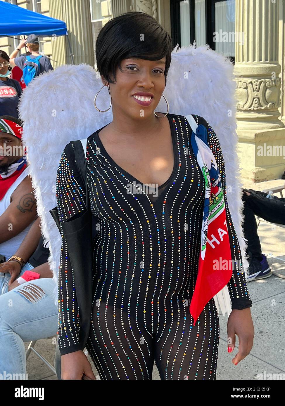 Portrait of a soman with angel wings at the West zIndian Day Parade in ...