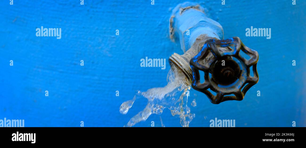 Water faucet spraying cool water flowing with drops blue Stock Photo ...