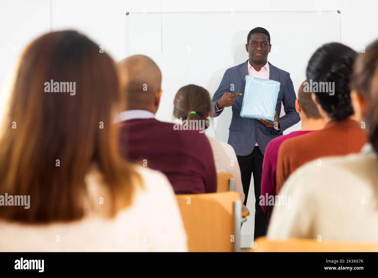 An entrepreneur advertises product at business training Stock Photo - Alamy