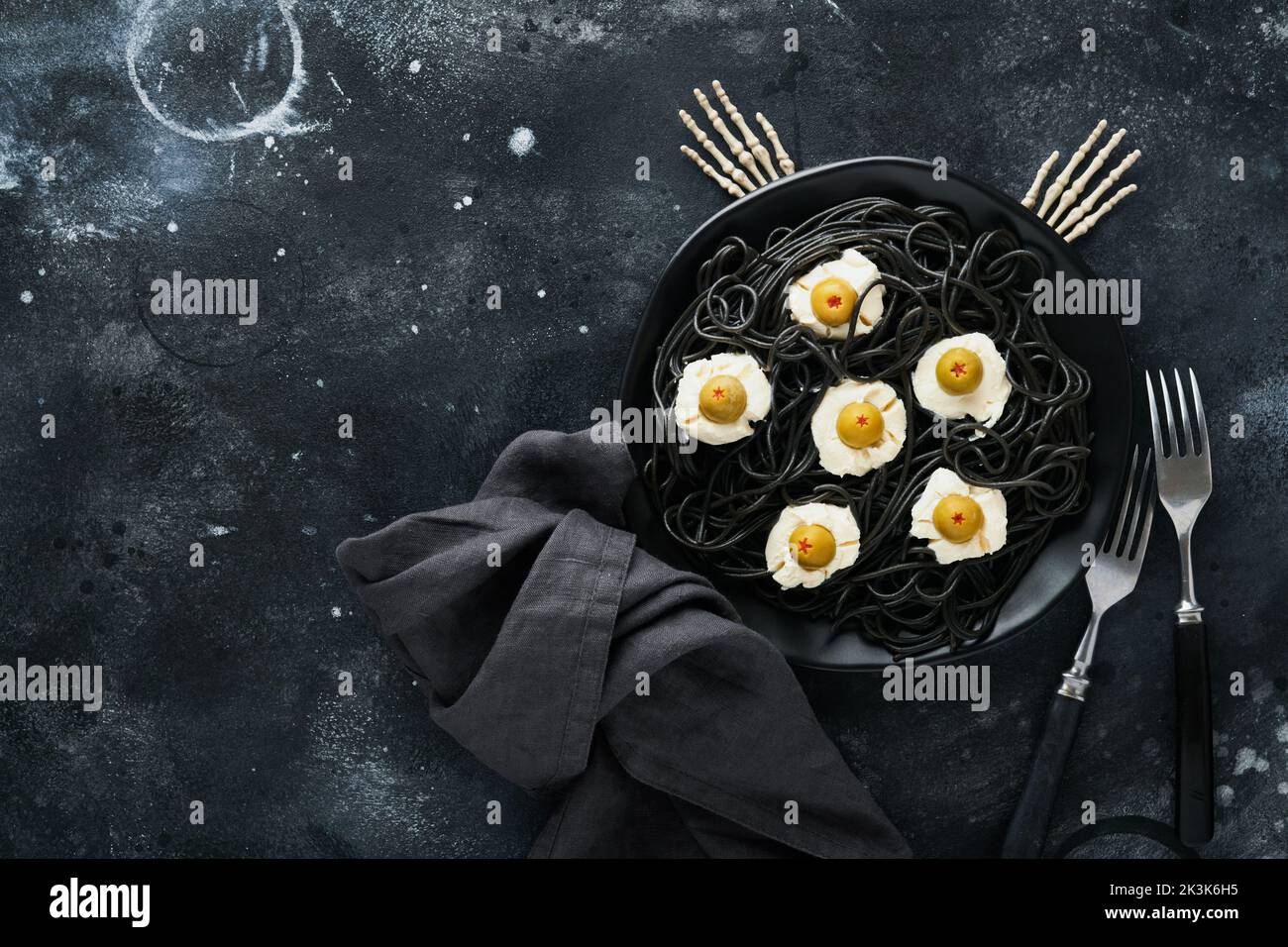 Halloween party Italian black pasta decorated horror olives like eyes ...