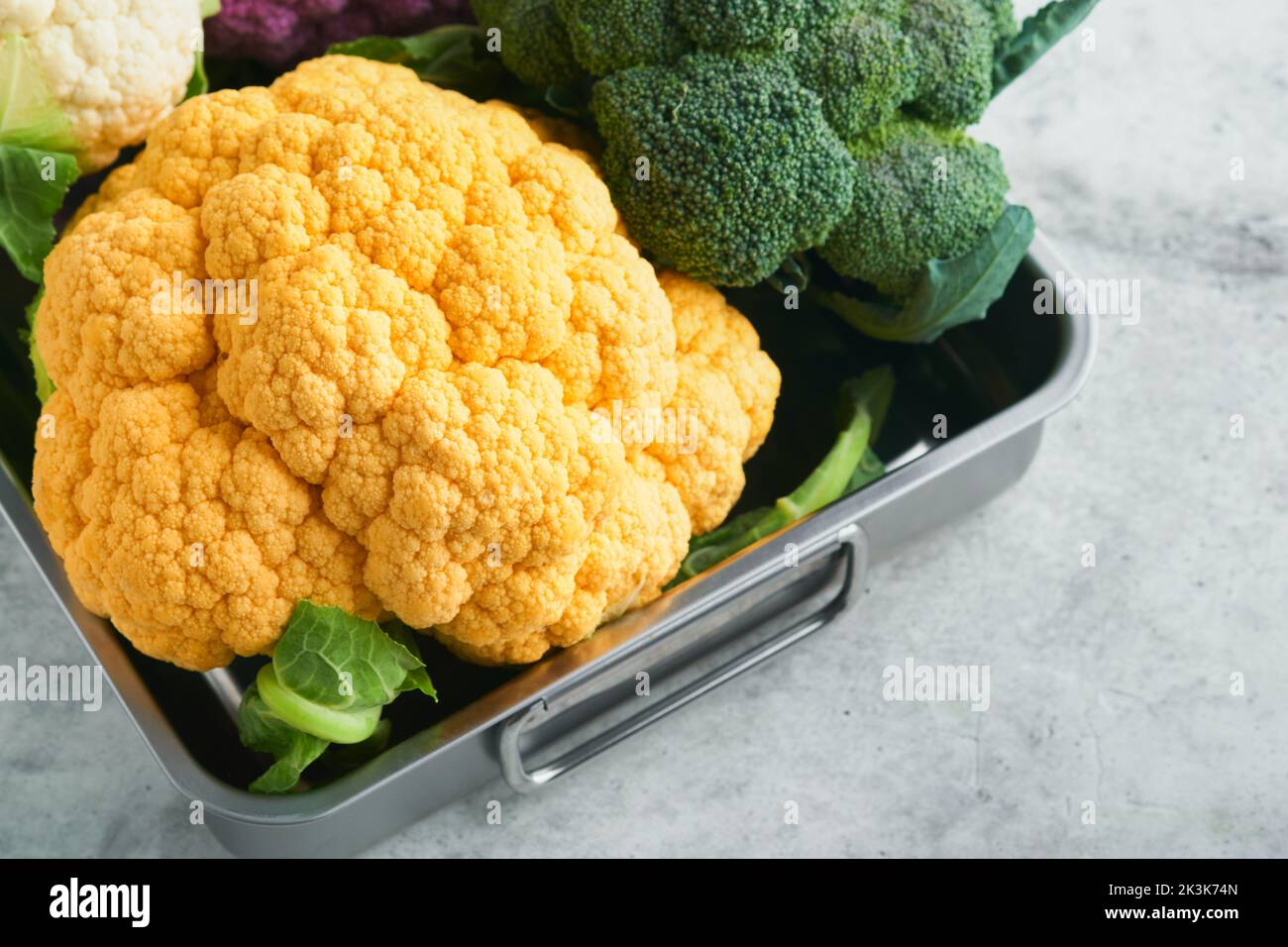 Colorfu cauliflower. Various sort of cauliflower on gray concrete ...