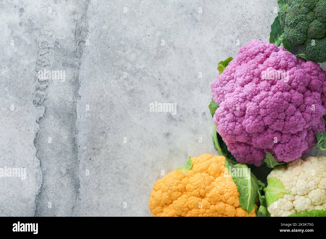Colorfu cauliflower. Various sort of cauliflower on gray concrete ...